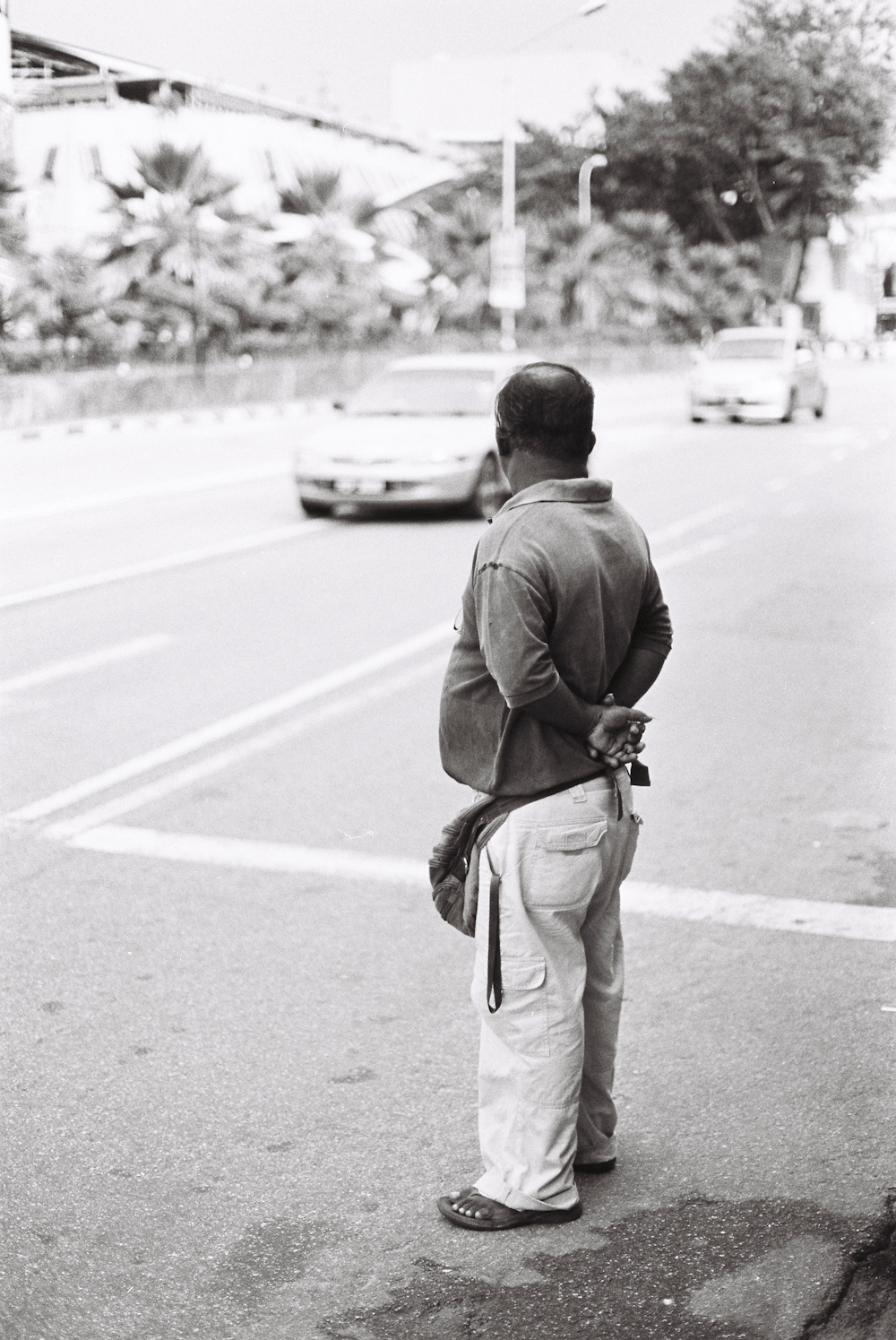 Man Standing in the Streets of Penang Malaysia - Entouriste